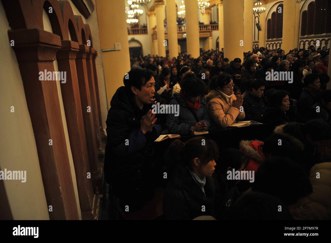 Catholic worshippers attend a Christmas mass in the Pinganqiao Catholic ...