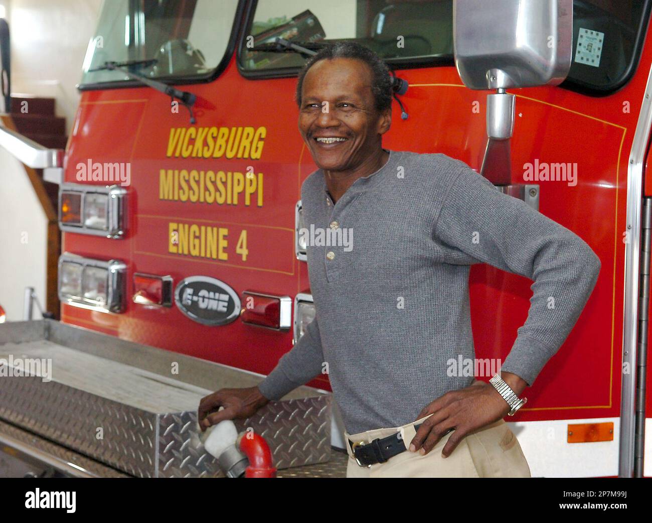 Retired batalion chief Donnell Wince leans on a fire truck at Central ...