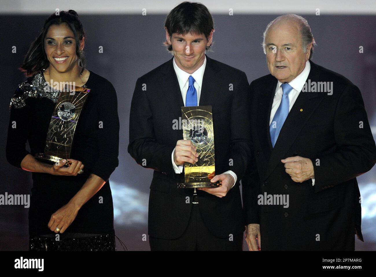 Soccer player Marta, left, from Brazil and Lionel Messi, center, from ...