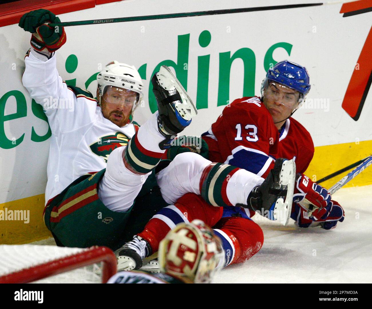 Minnesota Wild's Greg Zanon, left, falls over Montreal Canadiens' Mike ...