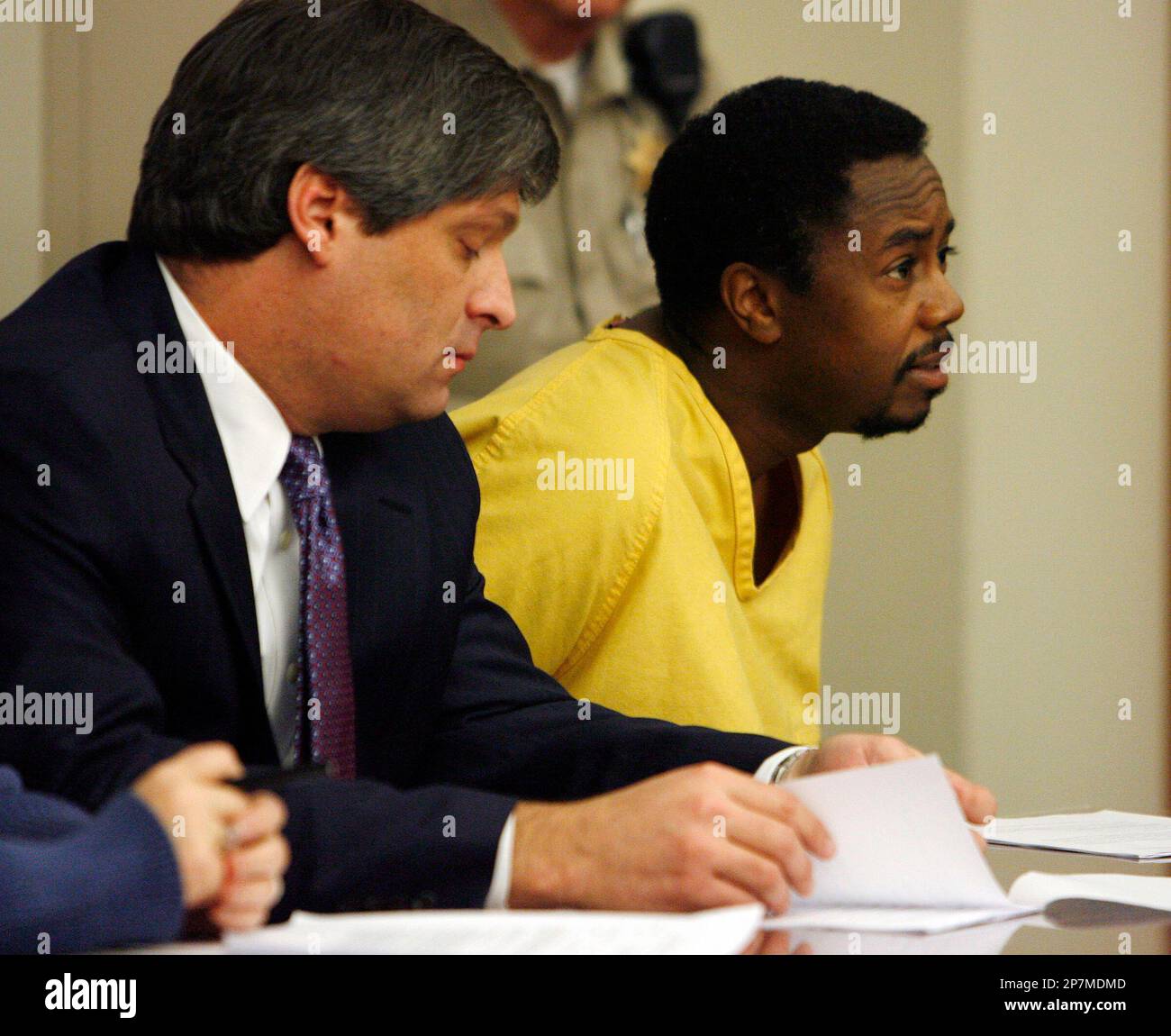 James William Tolbert, right, answers questions asked by Judge Thomas ...