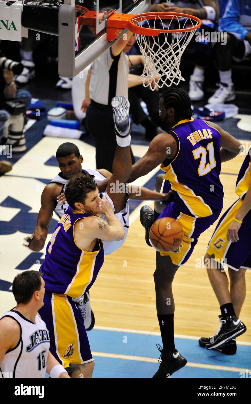 Utah Jazz guard Ronnie Price (17) is fouled by Los Angeles Lakers ...