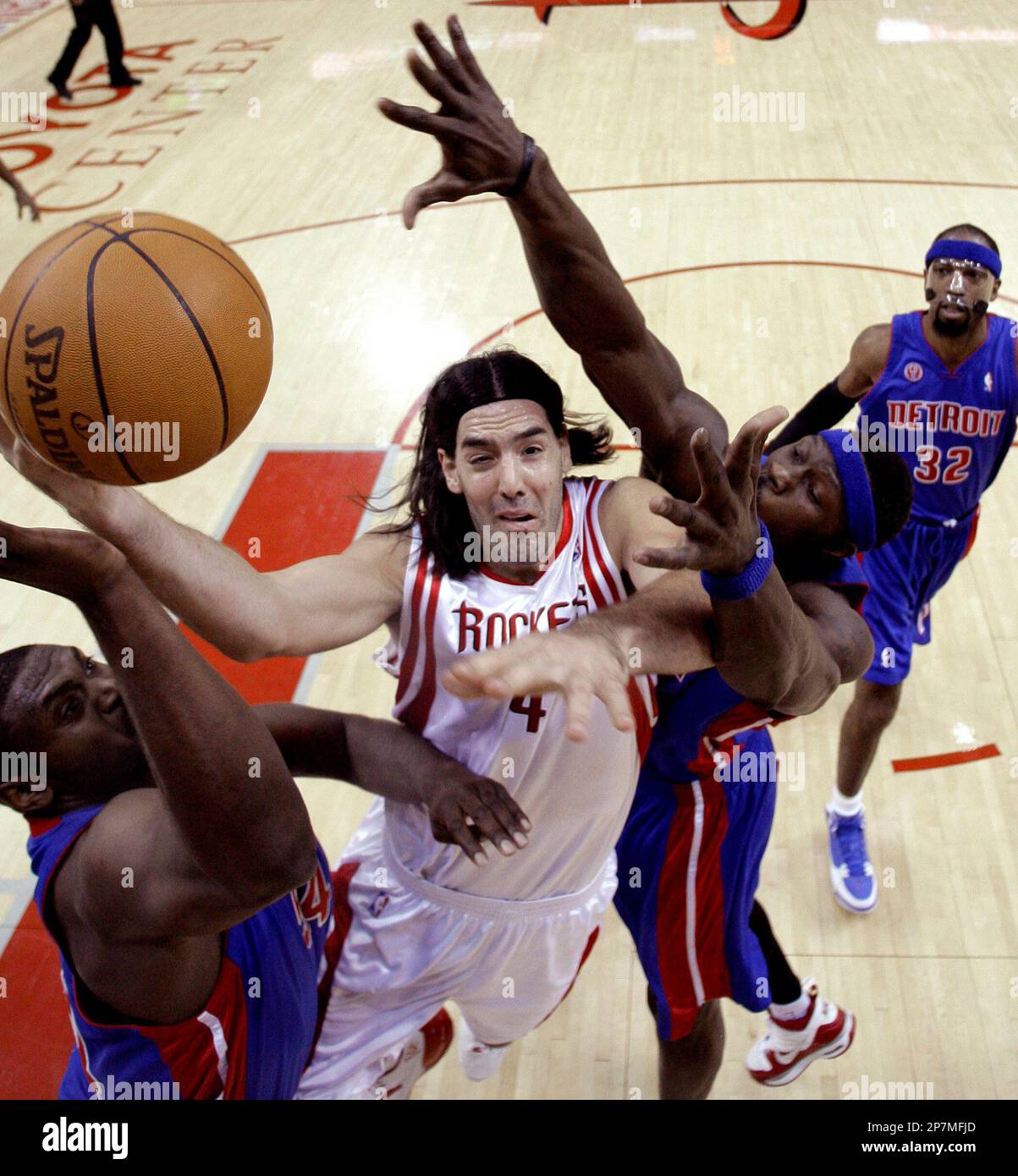 Houston Rockets' Luis Scola (4), of Argentina, goes up for a shot as ...