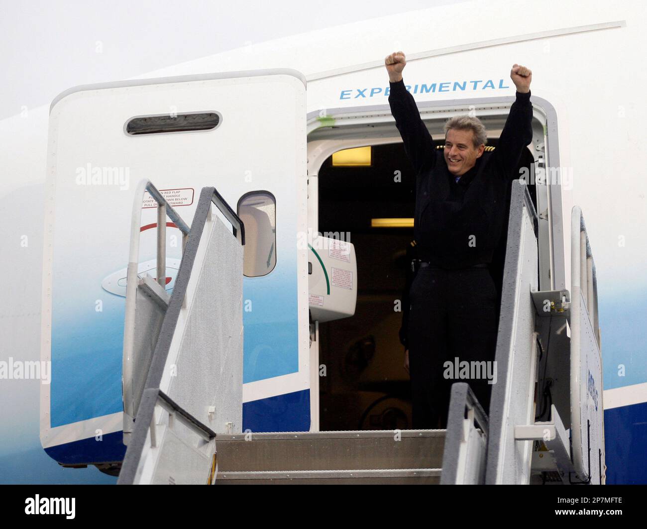 Boeing 787 Chief Pilot Mike Carriker celebrates as he exits a Boeing Co ...