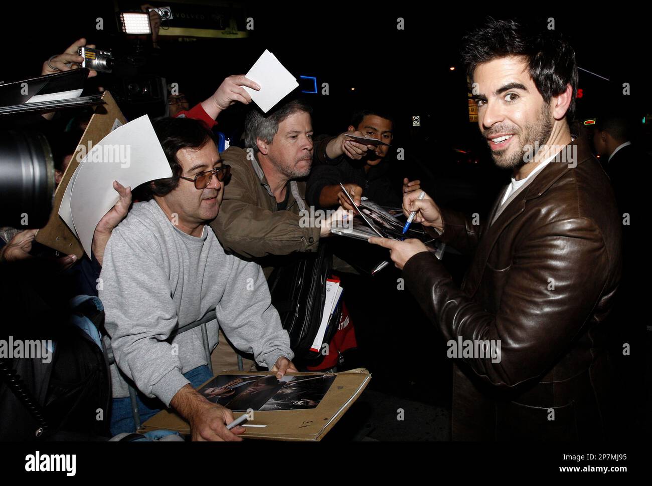 Cast member Eli Roth signs autographs for fans at the Blu-Ray and DVD ...
