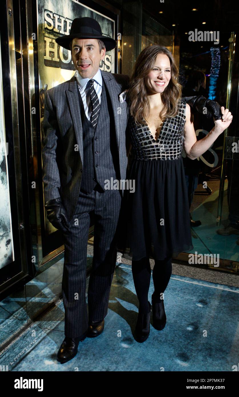 U.S. actor Robert Downey Jnr, left, arrives with his wife Susan Levin ...