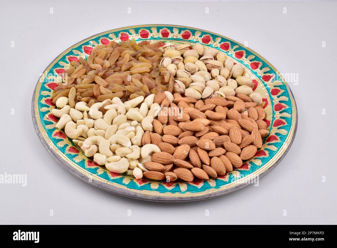 Dry fruit and nuts on plate isolated on white background, diwali gift ...