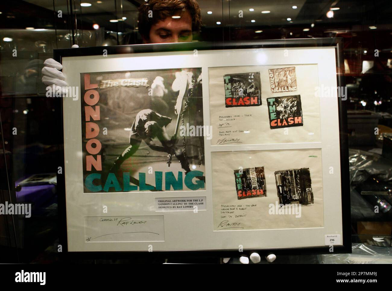 A Bonham's employee displays the original album cover artwork by Ray ...