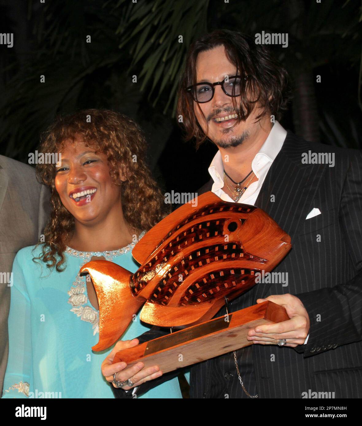US actor Johnny Depp, right, holds the Bahamas Film Festival's Career ...