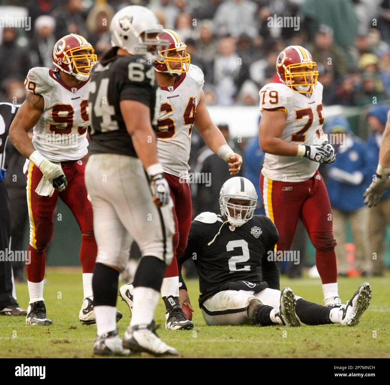 Oakland Raiders quarterback JaMarcus Russell (2) sits on the ground ...