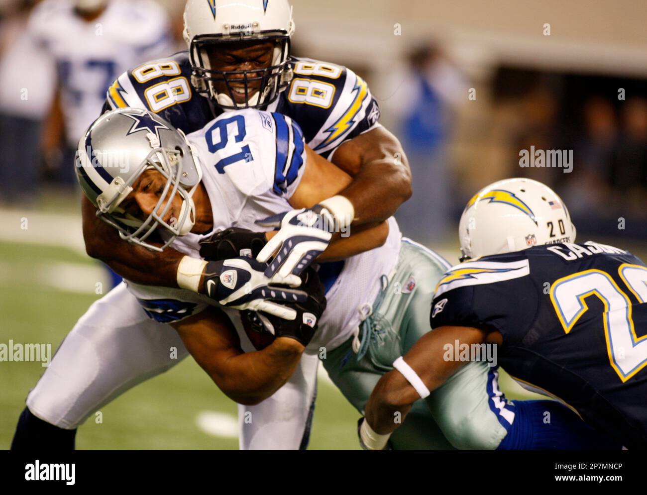 Dallas Cowboys Wide Receiver Miles Austin (19) is stopped by San Diego ...