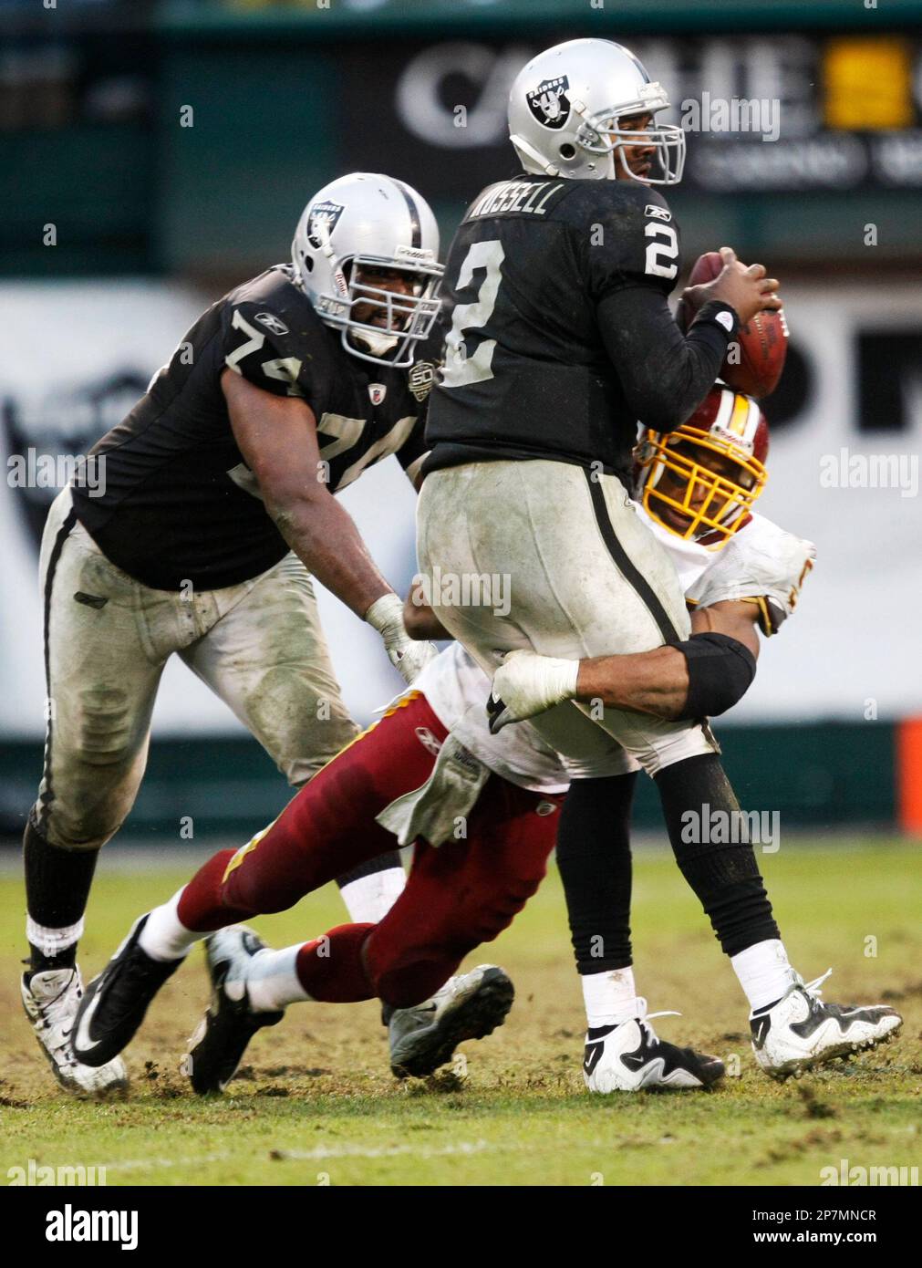 Oakland Raiders quarterback JaMarcus Russell (2) is sacked by ...