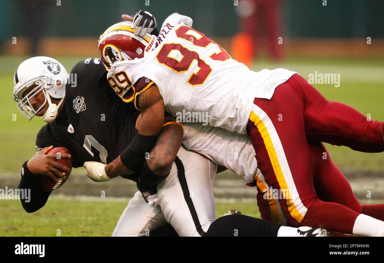 Oakland Raiders quarterback JaMarcus Russell (2) is sacked by ...