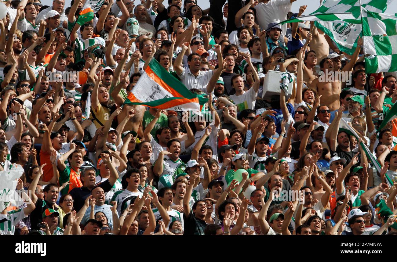 Banfield's fans cheer their team before the start of an Argentine ...