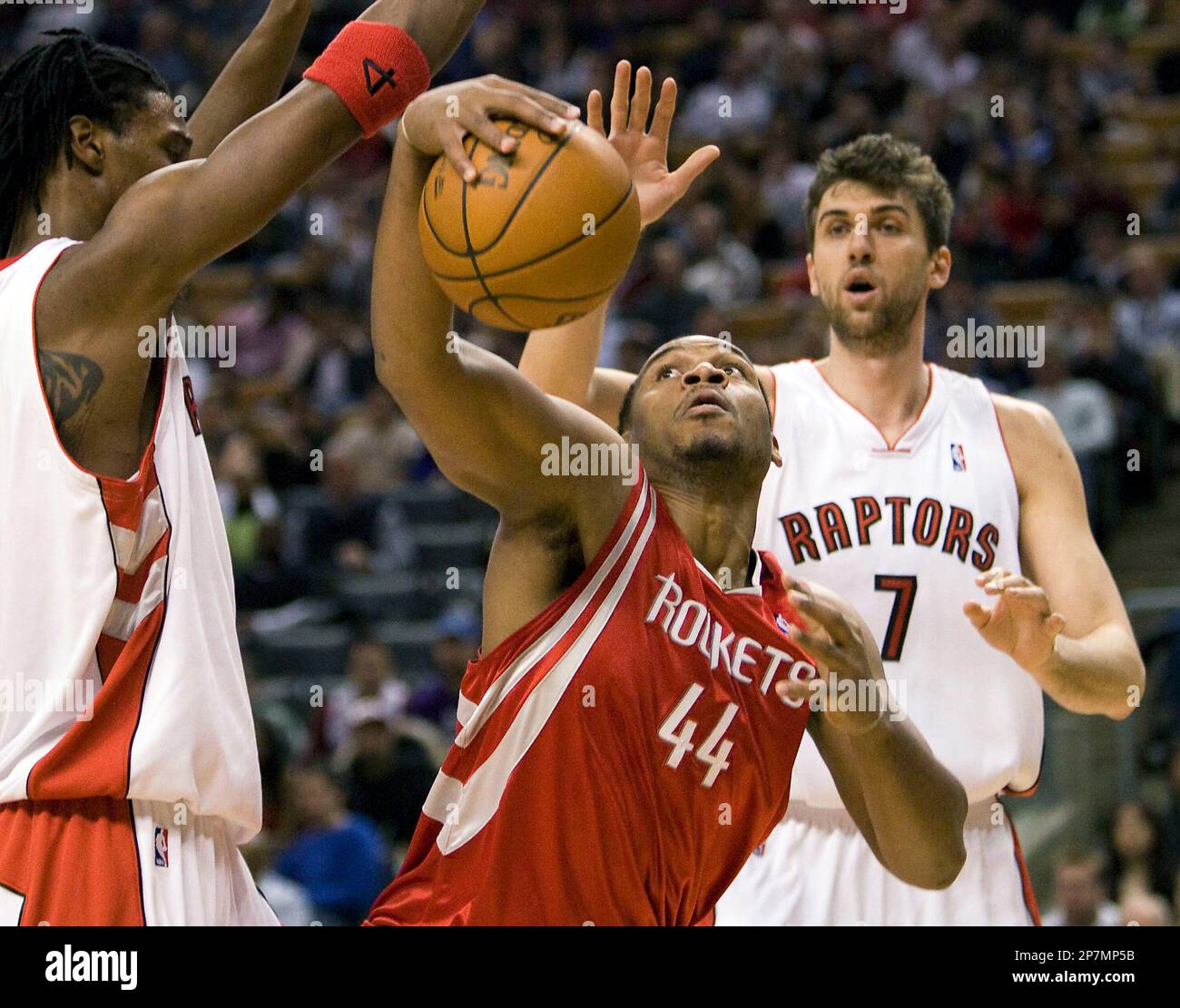 Houston Rockets forward Chuck Hayes (44) rebounds against Toronto ...