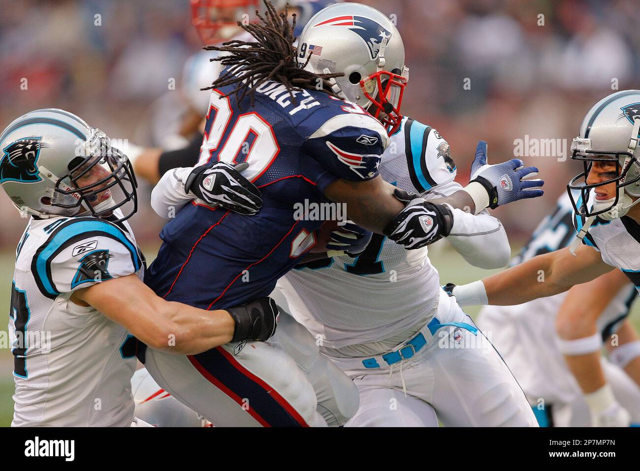 New England Patriots running back Laurence Maroney (39) is surrounded ...