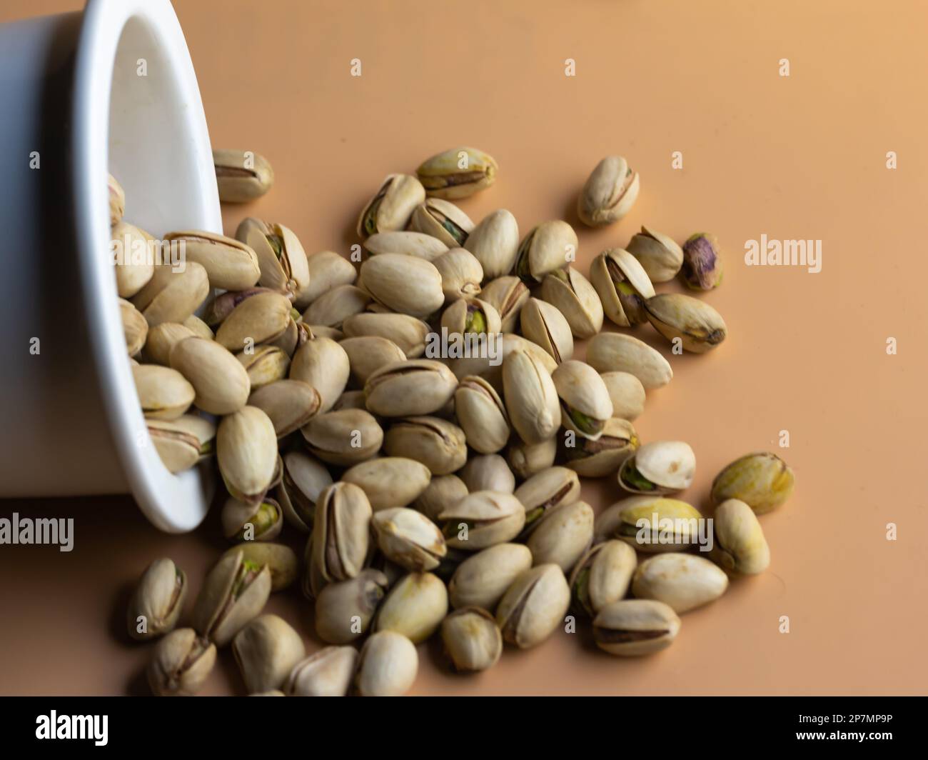 pistachio nuts in shell in a cream color background Stock Photo - Alamy