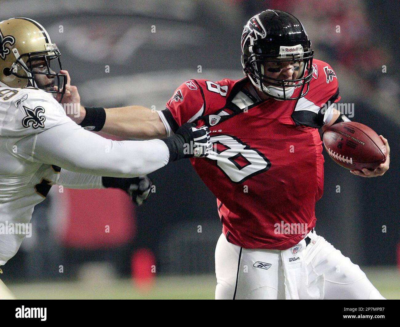 Atlanta Falcons quarterback Chris Redman, right, is stopped by New ...