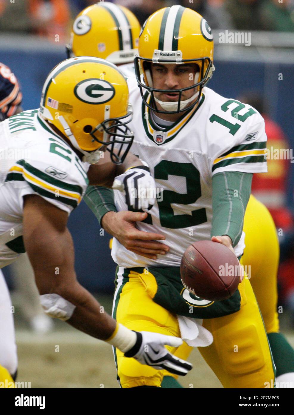 Green Bay Packers quarterback Aaron Rodgers (12) hands off to running ...