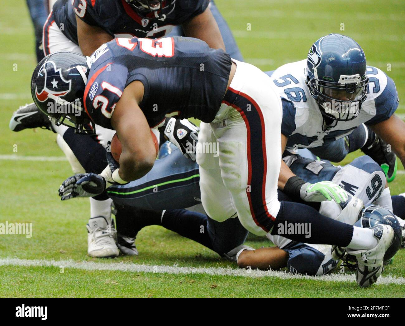 Houston Texans running back Ryan Moats (21) stumbles over the goal line to score as Seattle ...