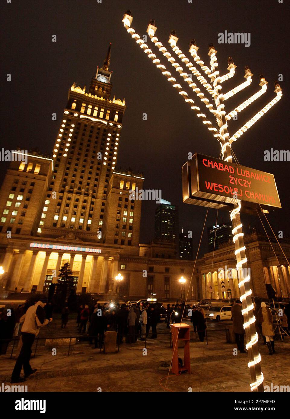 The candles of an 8-meter (26-foot) menorah burn in celebration of ...