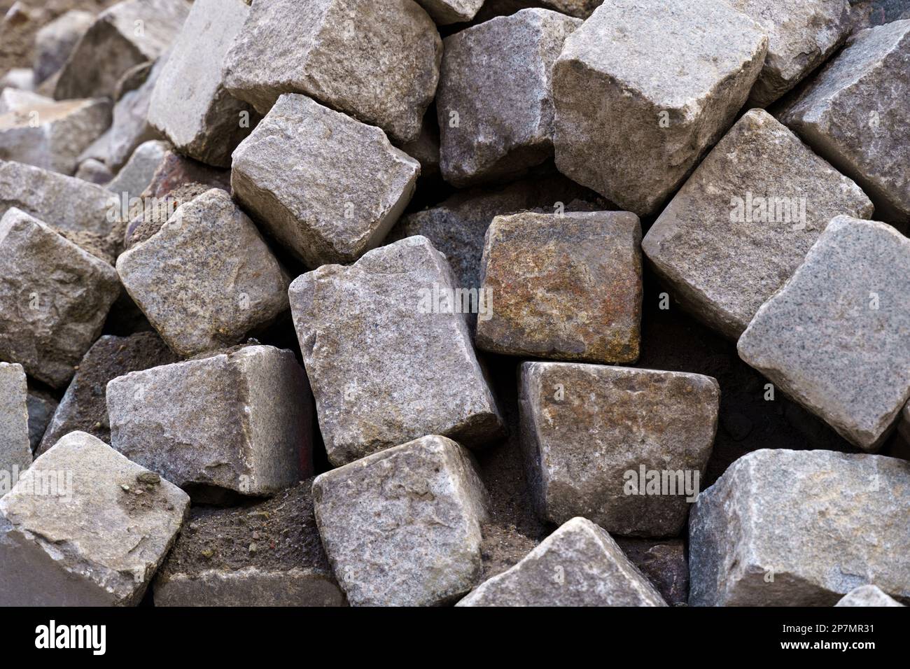 A pile of old large gray stone blocks. Close-up Stock Photo - Alamy