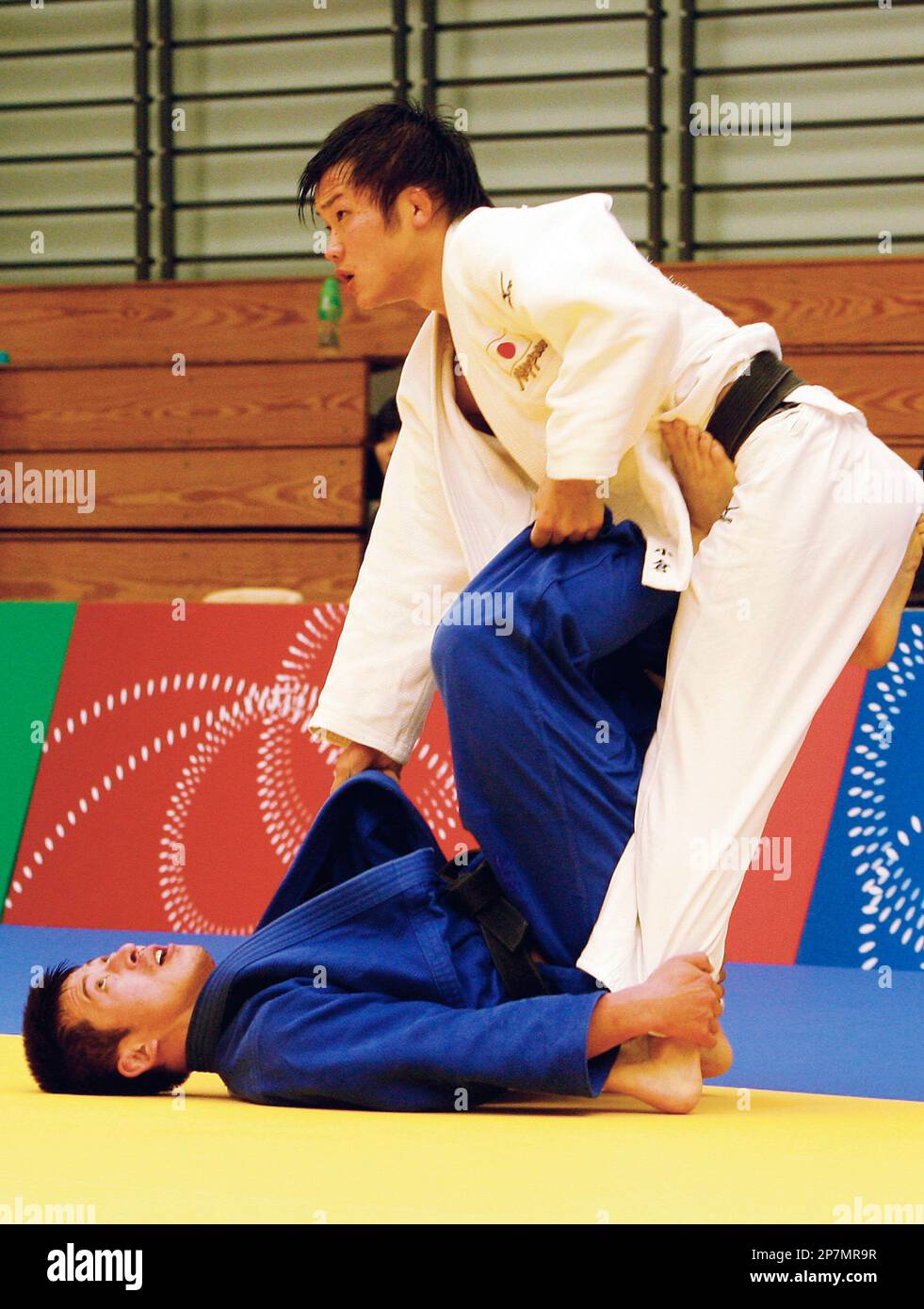 Musashi Ogura of Japan, in white uniform, and Ri Chol Ryong of North ...