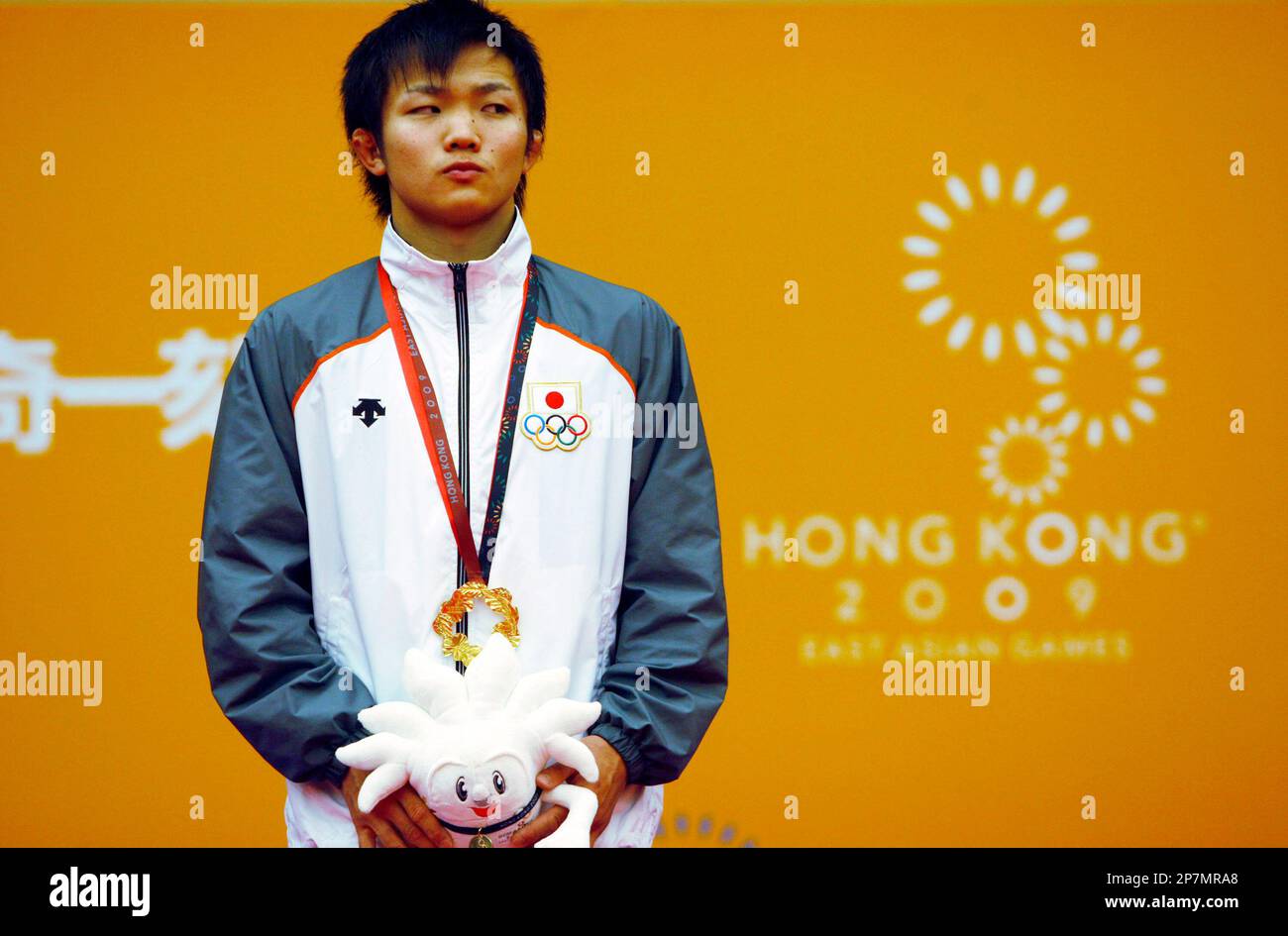 Musashi Ogura of Japan listens to the Japanese national anthem during ...