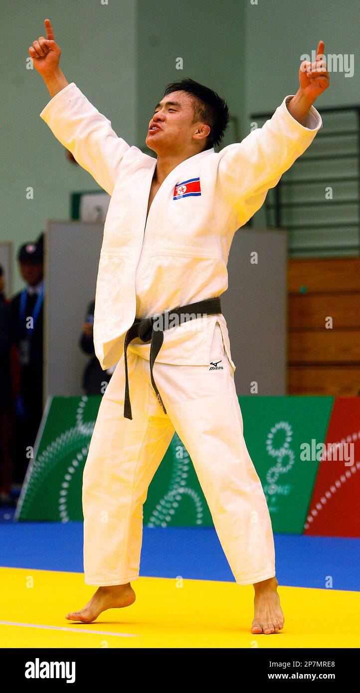 Kim Kyong Jin of North Korea celebrates after defeating Daisuke Asano ...