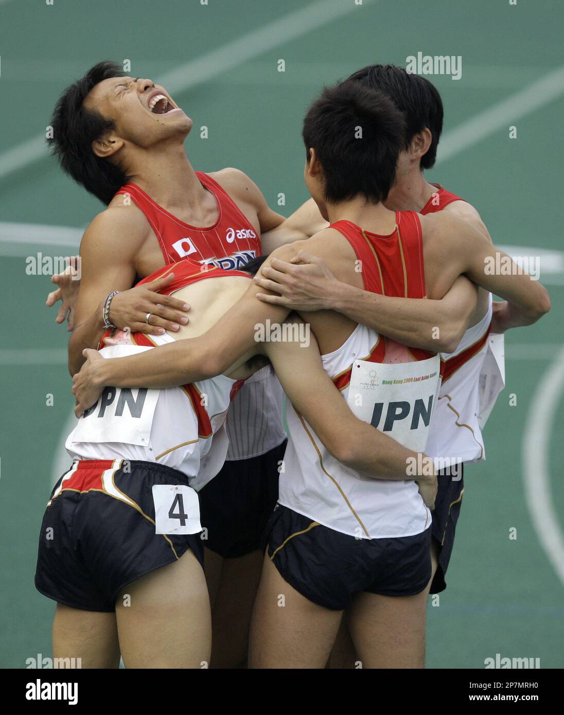 The Japanese team celebrates after winning the men's 4 x 400 meter ...