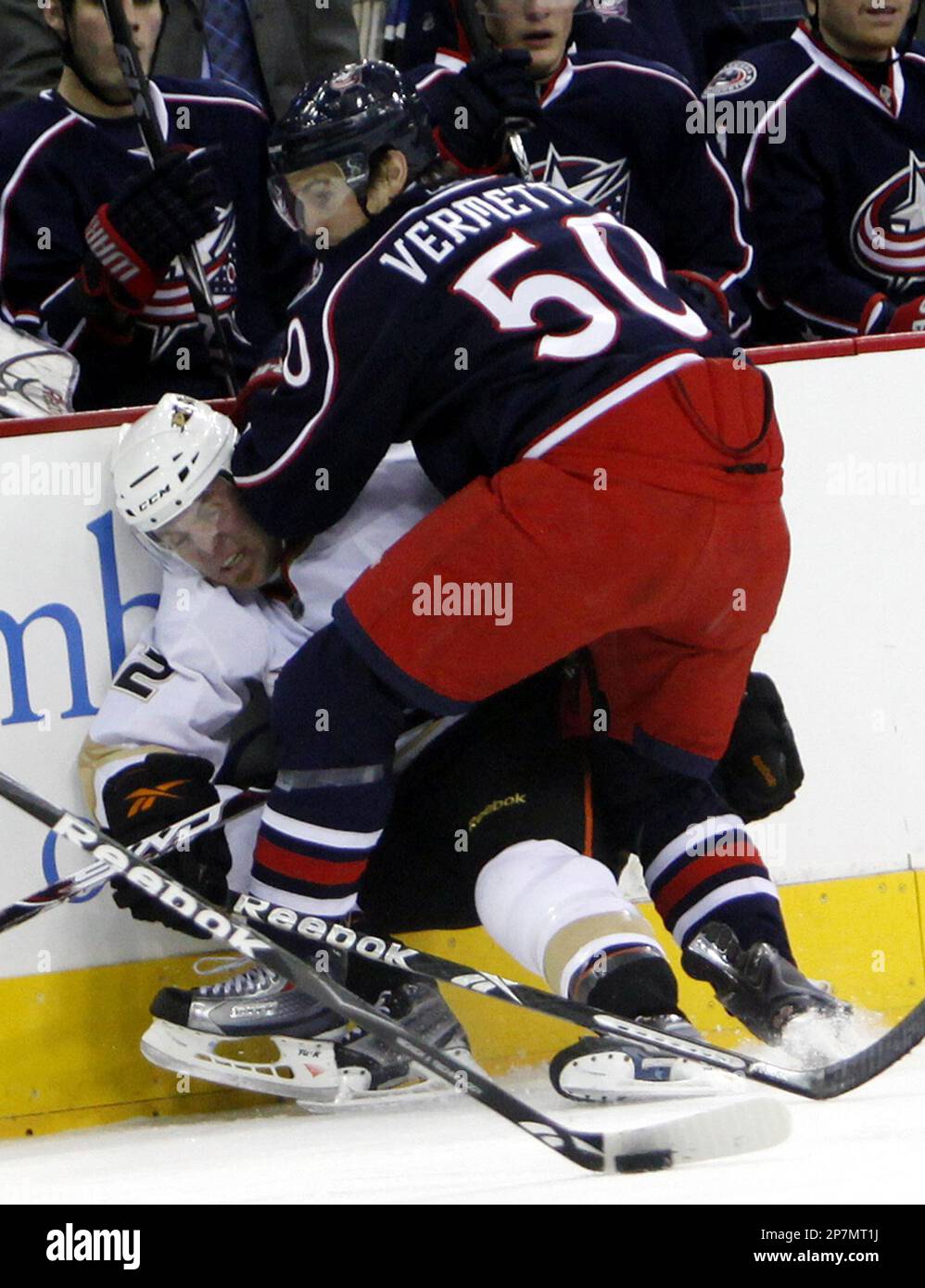 Columbus Blue Jackets' Antoine Vermette (50) checks Anaheim Ducks' Kyle ...