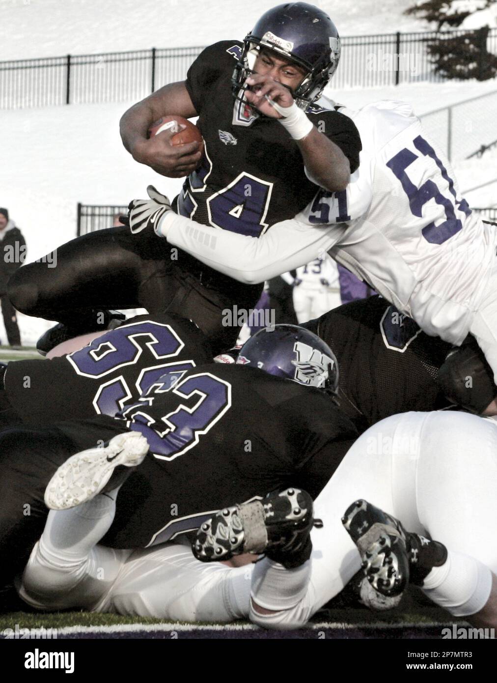 Wisconsin-Whitewater Antwan Anderson dives over the top of the ...