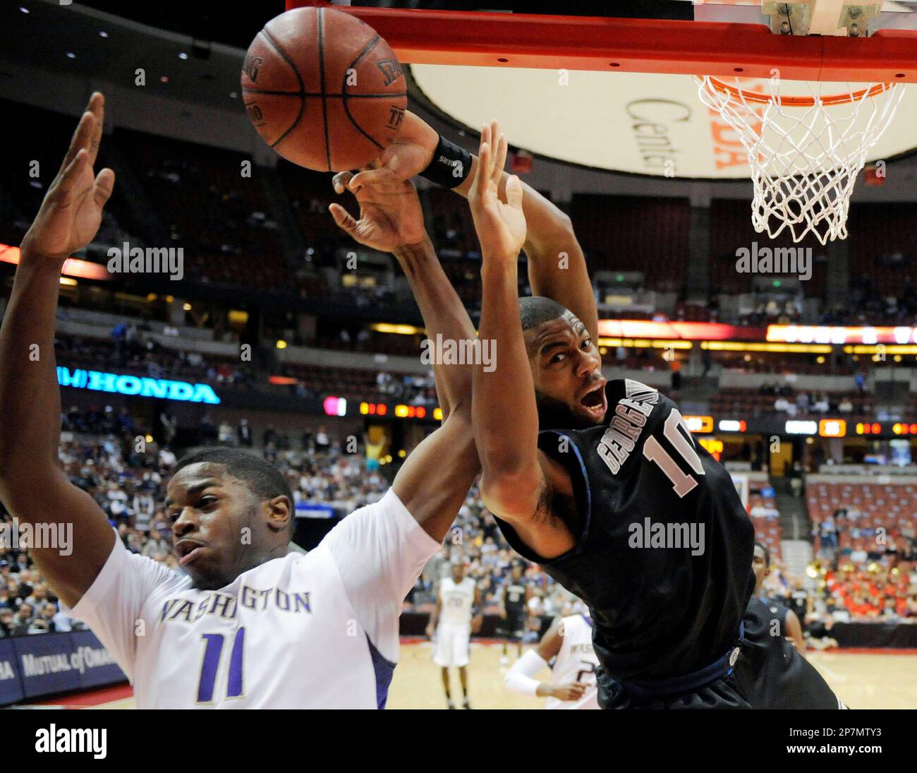 Washington's Matthew Bryan-Amaning,, left, and Georgetown's Greg Monroe ...