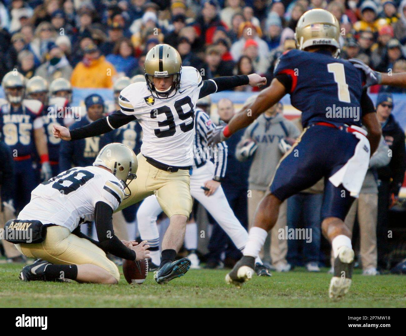 Army's Alex Carlton (39) kicks a field goal as teammate Jonathan Bulls ...