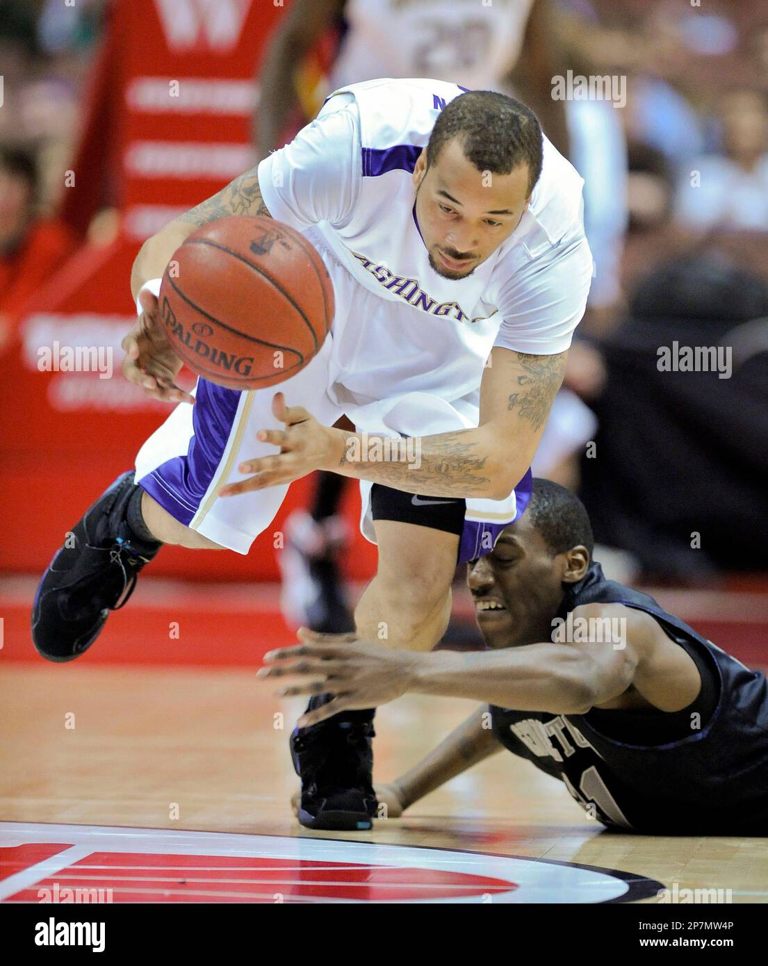 Georgetown's Jason Clark, right, dives for the ball as Washington's ...