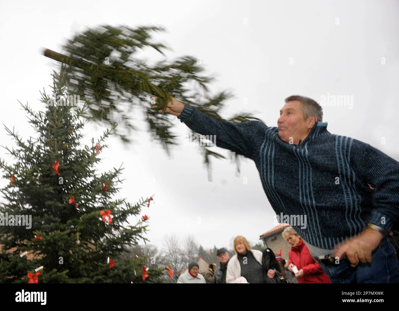Dieter Hartmann throws a Christmas tree during a competition in Gadow ...