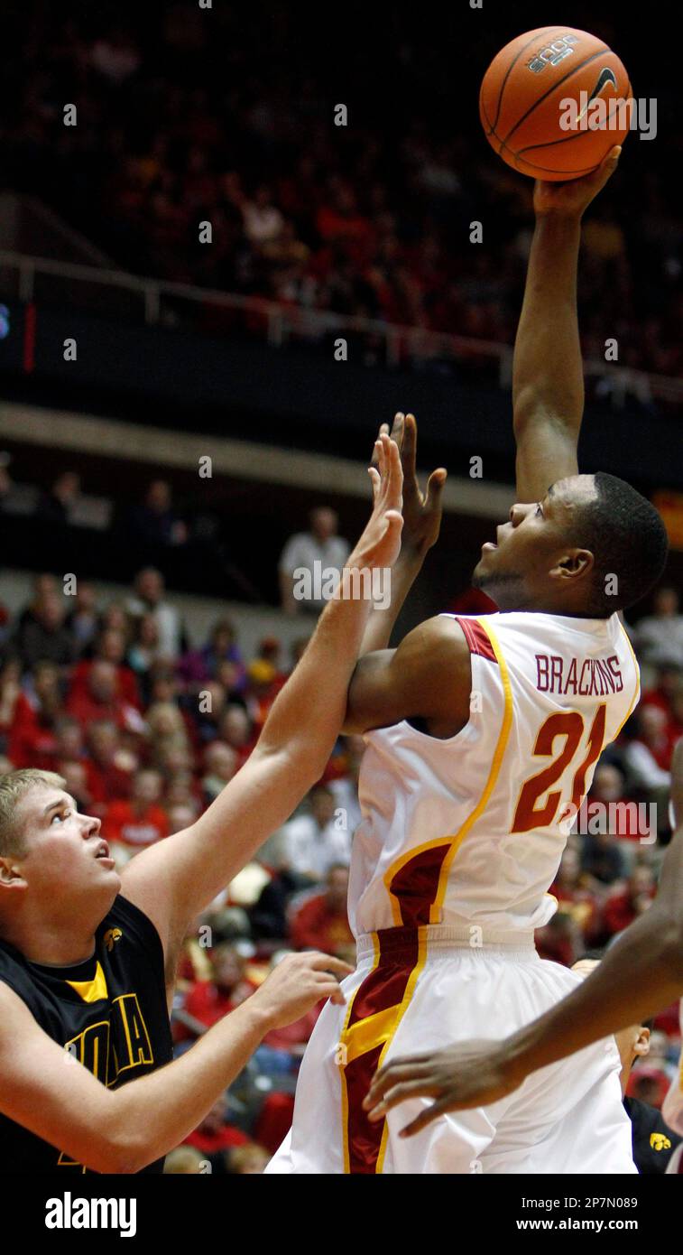 Iowa State's Craig Brackins, right, shoots over Iowa's Brennan Cougill ...
