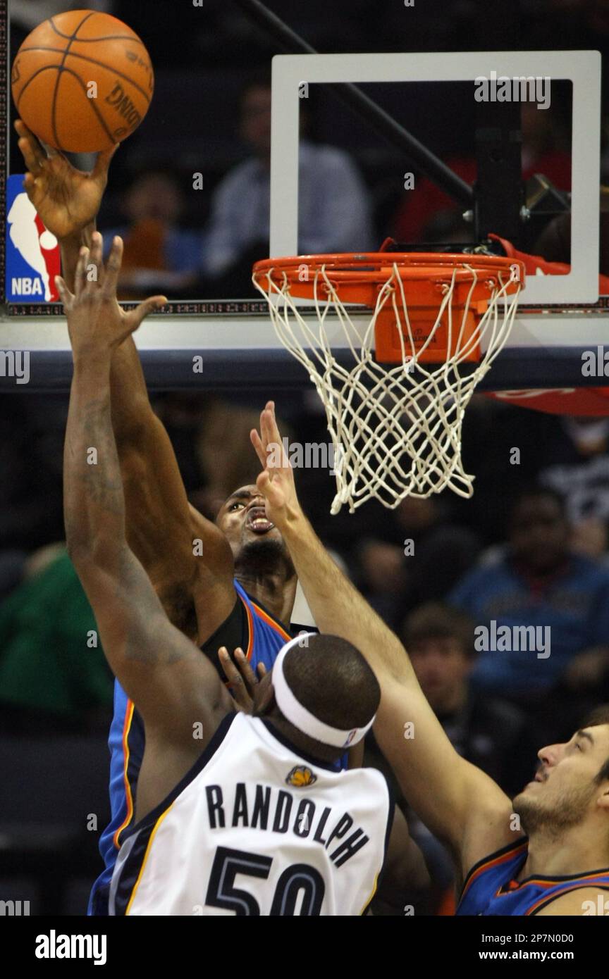 Oklahoma City Thunder forward Serge Ibaka, left, blocks a shot by ...