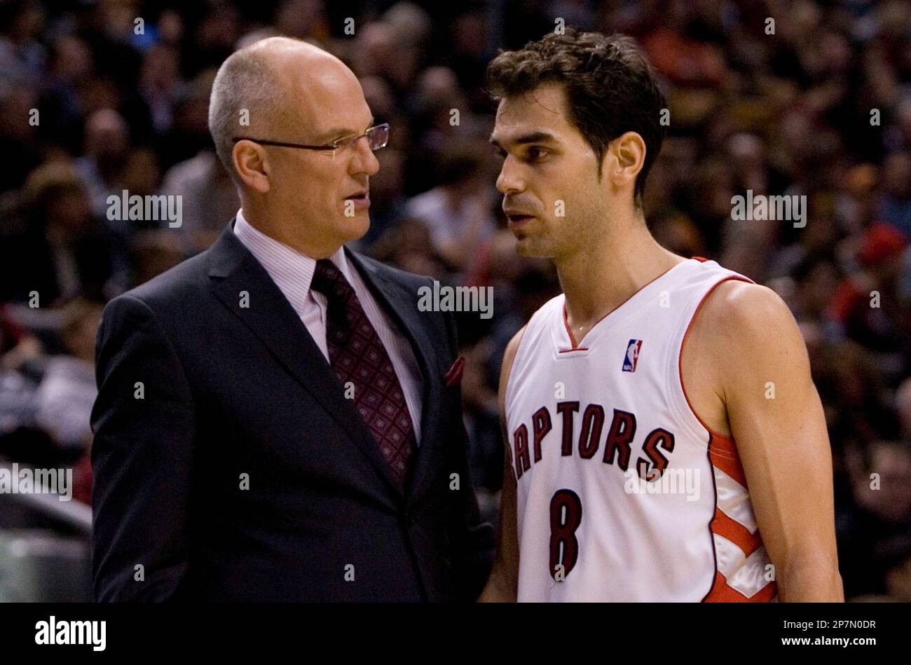 Toronto Raptors' coach Jay Triano, left, speaks with Jose Calderon ...