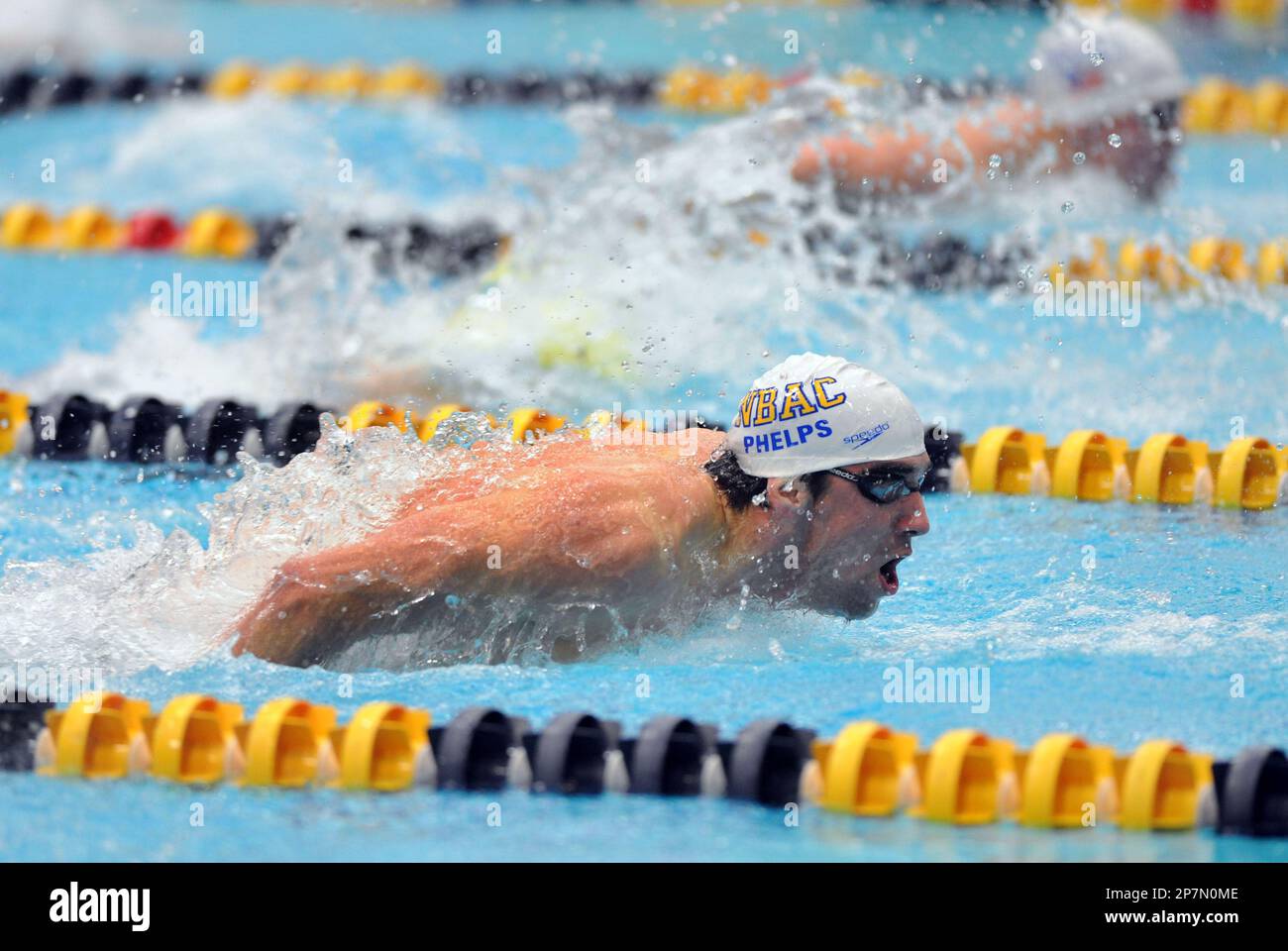 Michael Phelps competes in the boys' open 100-yard butterfly swimming ...