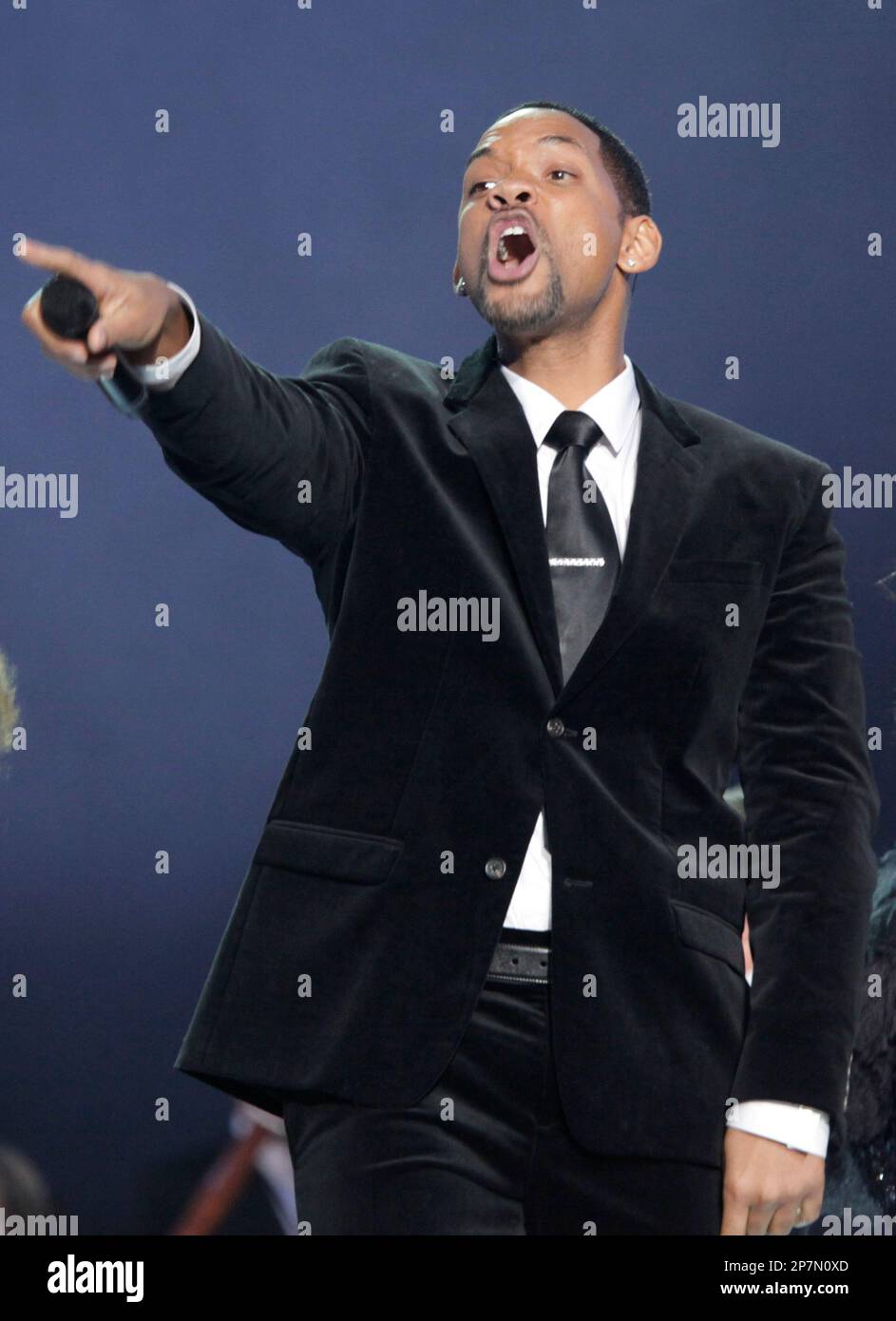 Will Smith gestures to the crowd at the conclusion of the Nobel Peace ...