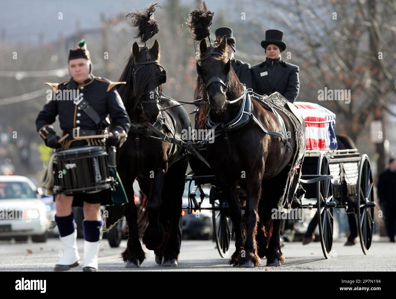 The body of Lakewood, Wash. police Sgt. Mark Renninger is carried on a ...