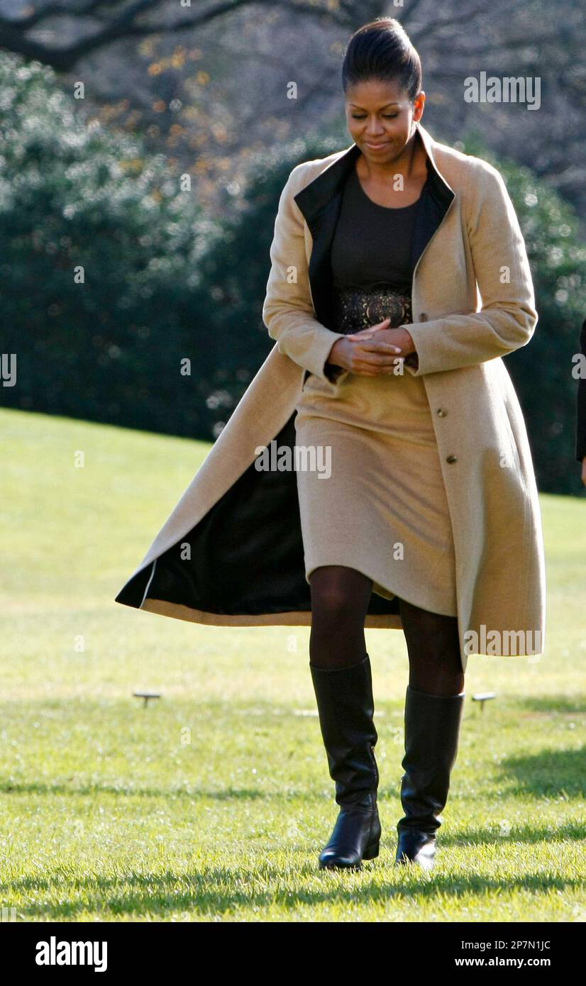 First lady Michelle Obama walks across the South Lawn of the White ...