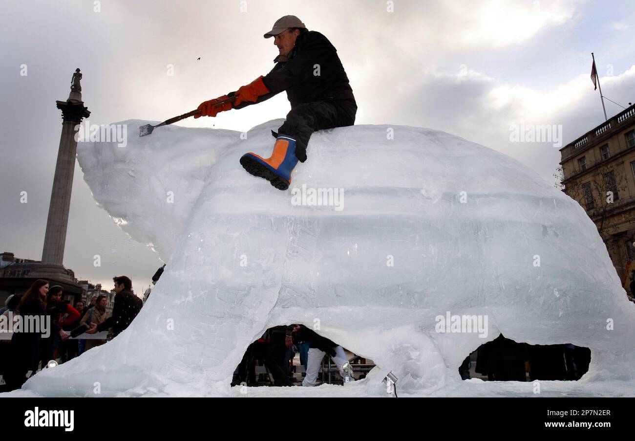 A life-sized ice sculpture of a hunting polar bear is finished by Mark ...