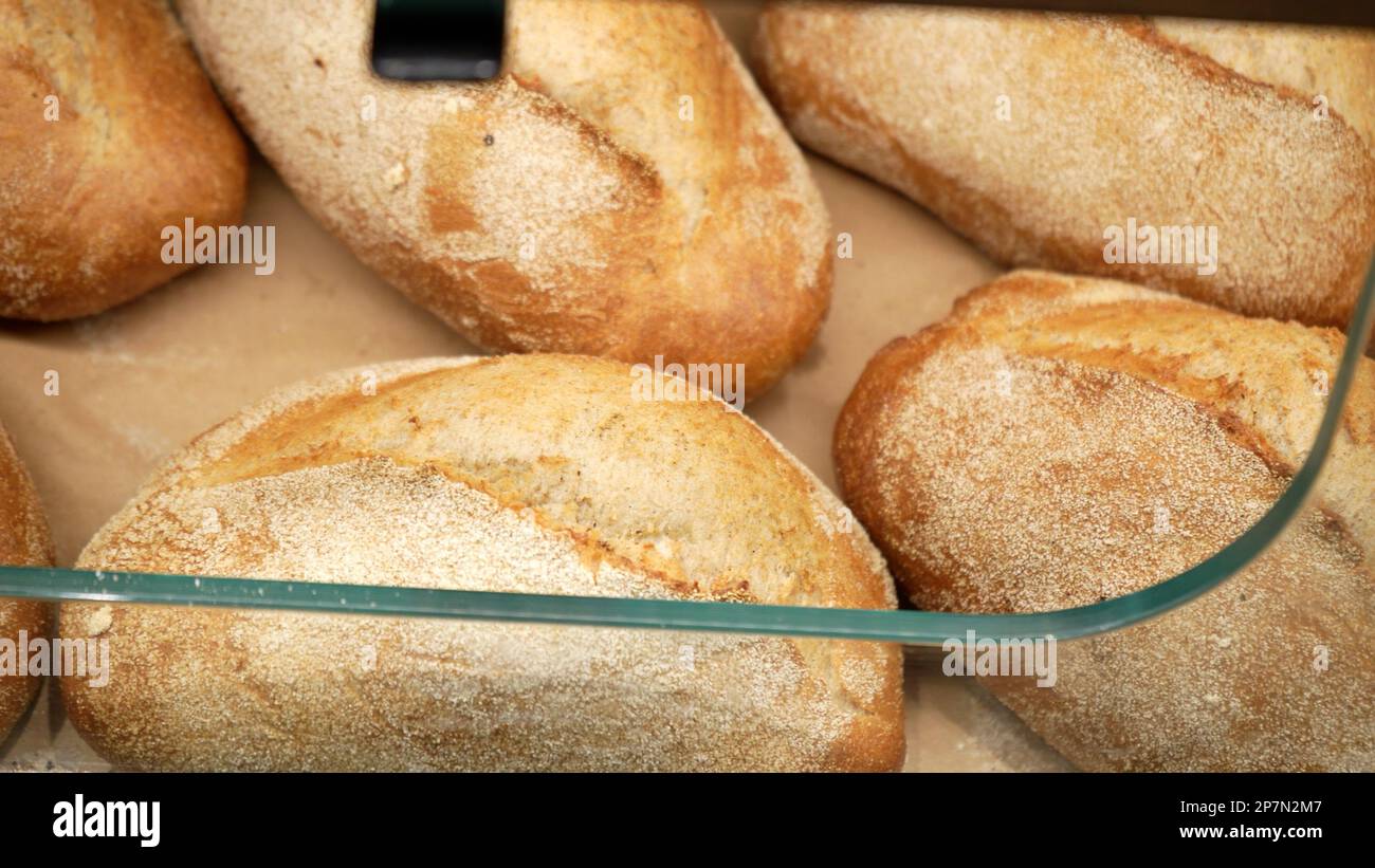 Fresh bread on the shelves of the bakery in the supermarket. Shopping ...