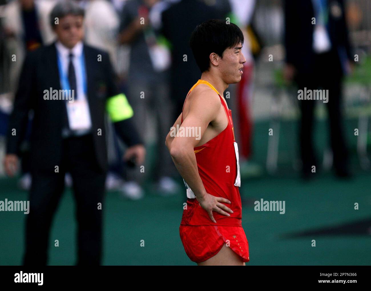Chinese hurdler Liu Xiang (C) competes in the men's 110-meter hurdles ...