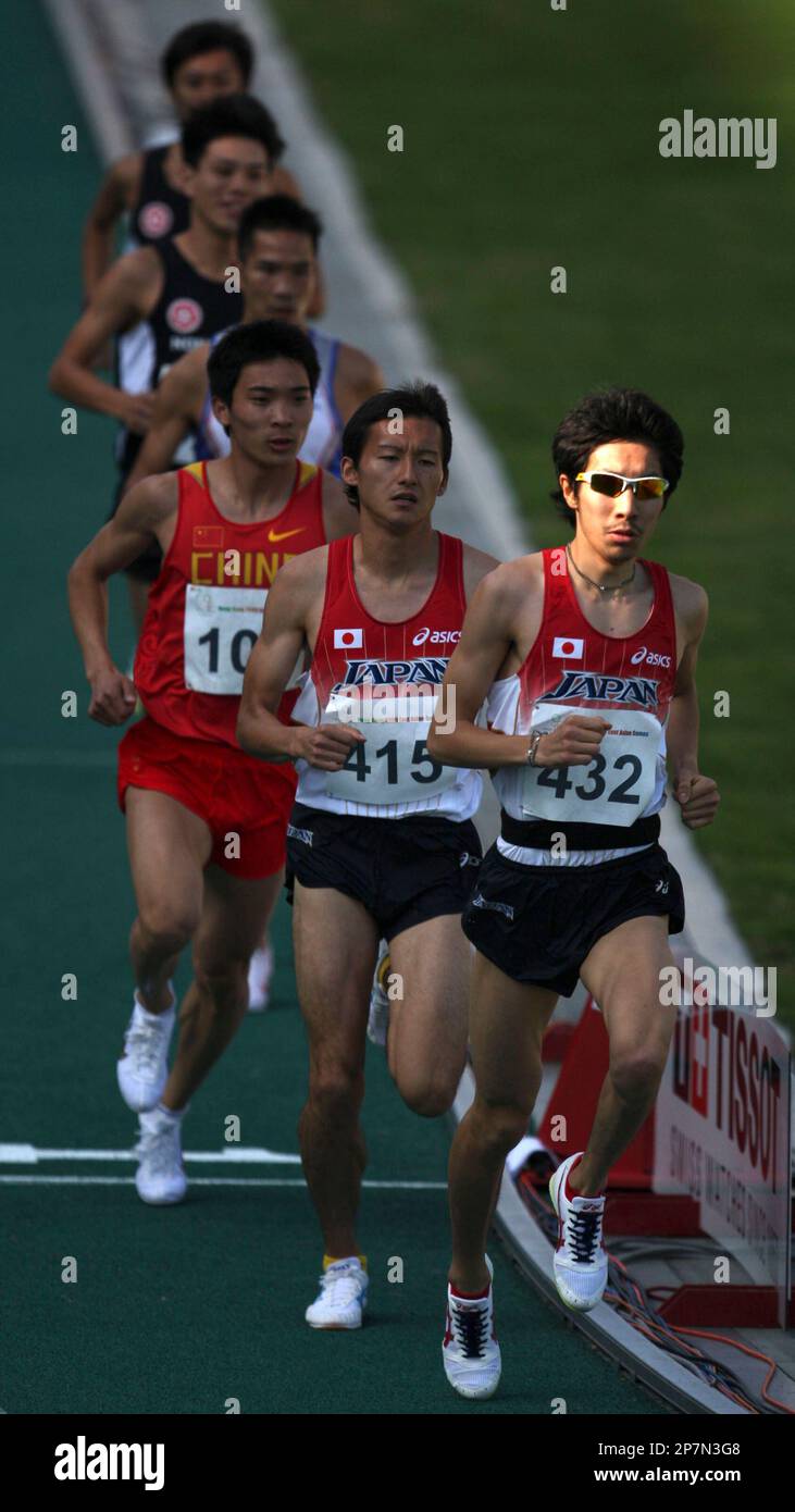 Runners compete in the men's 5,000-meter finals at the East Asian Games ...