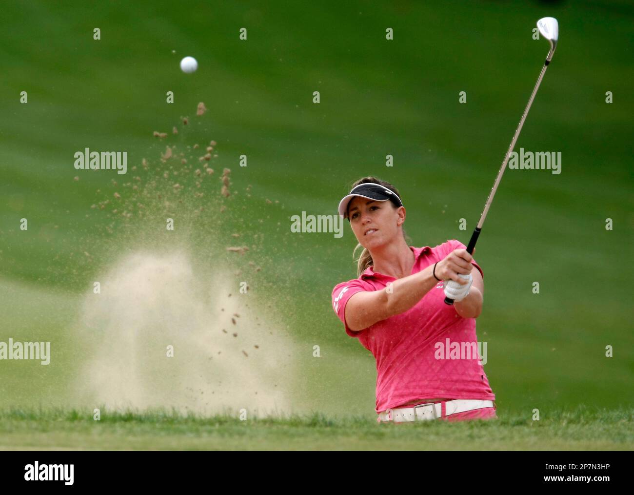 Australia's Dana Lacey plays a bunker shot on the first fairway during ...