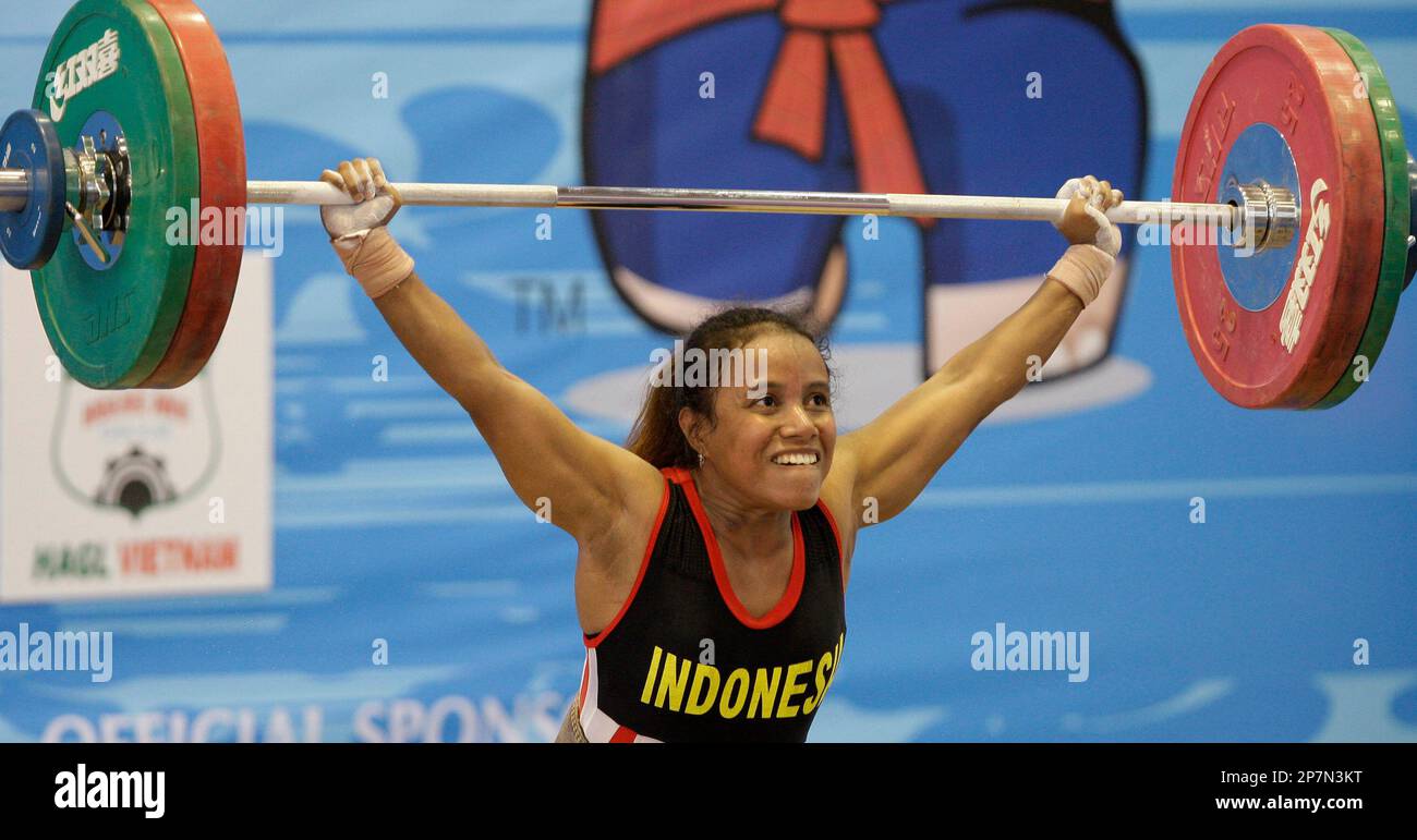Lisa Rumbewas of Indonesia competes in the snatch category of the women ...