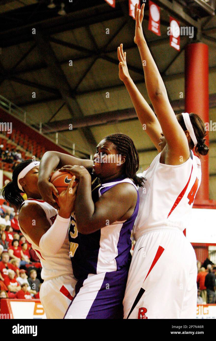 Prairie View's Whitney Williams (33), center, is doubled by Rutgers ...
